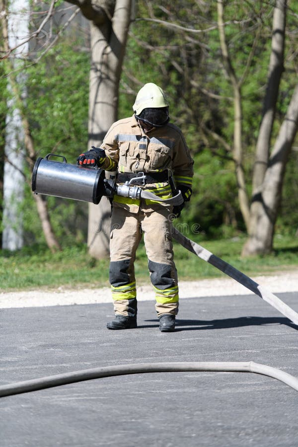 Firefighter with Fire Suppression Device in Hand Editorial Photo ...