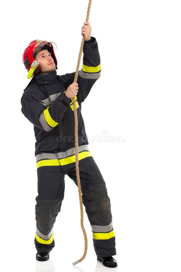 Firefighter pulling a rope stock photo. Image of full - 38318704