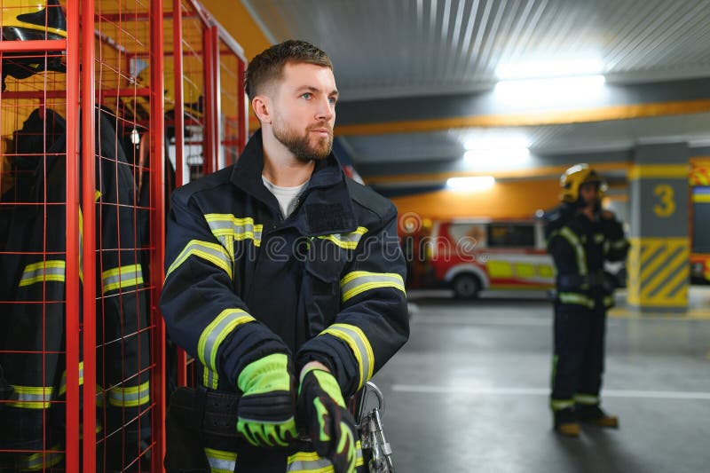 A Firefighter Puts on a Fire Uniform at the Fire Department Stock Image ...