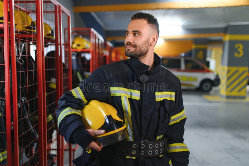 A Firefighter Puts on a Fire Uniform at the Fire Department Stock Image ...