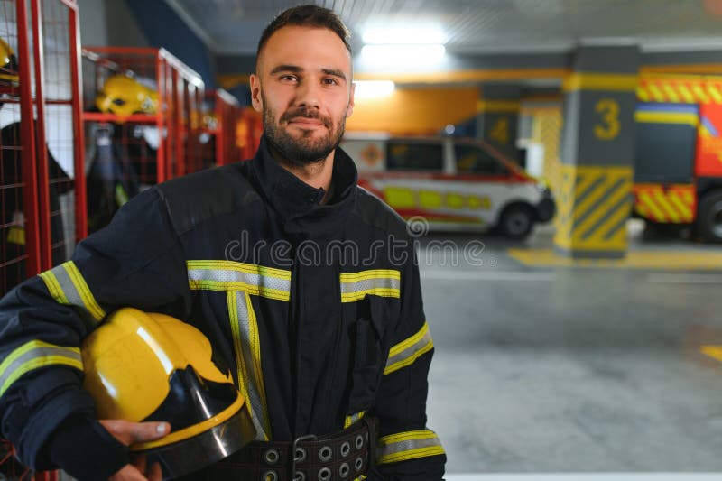 A Firefighter Puts on a Fire Uniform at the Fire Department Stock Photo ...