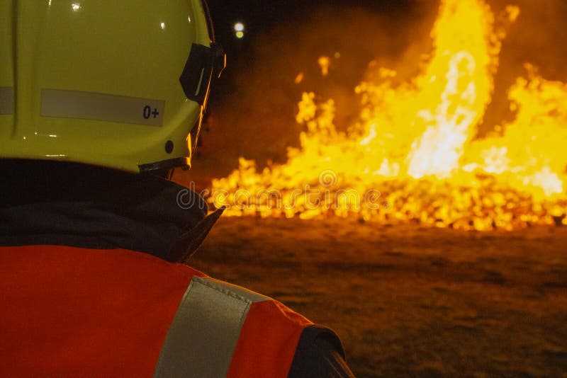 Firefighter Putting Out a Fire. Destruction and Disaster Stock Image ...