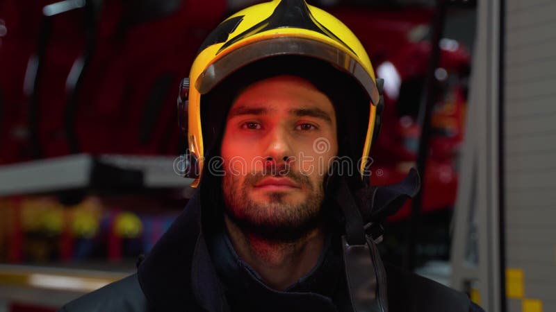 Firefighter Putting on Protective Helmet in Fire Station Stock Video ...