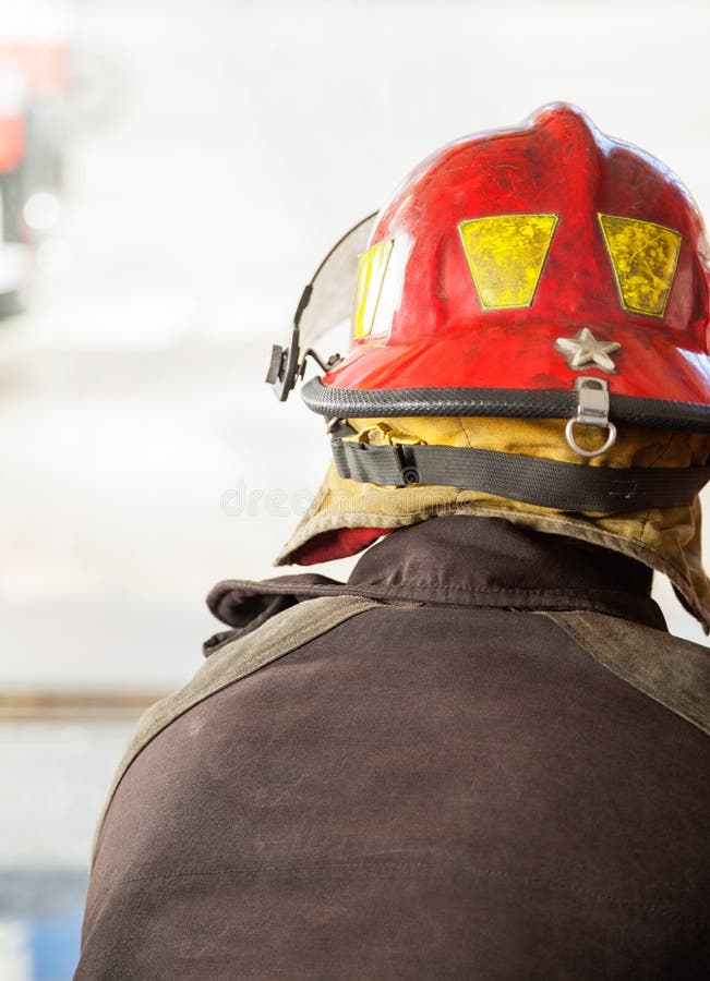 Firefighter in Red Helmet stock photo. Image of helmet - 68020168