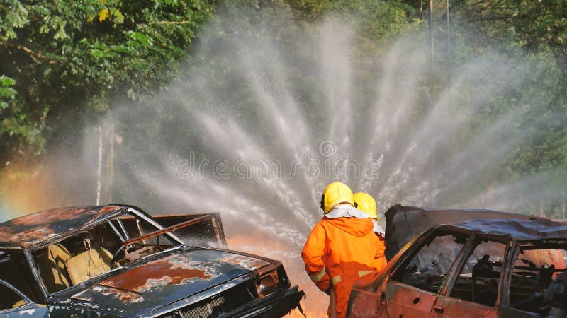 Firefighter Rescue Team Training in Fire Fighting Extinguisher ...