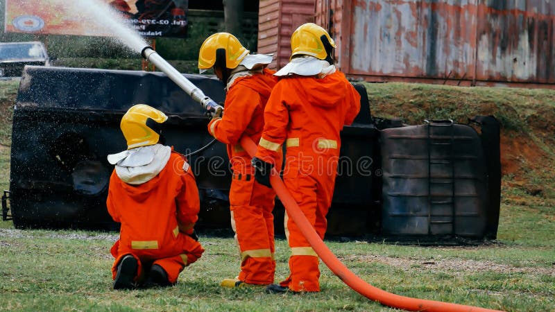 Firefighter Rescue Team Training in Fire Fighting Extinguisher ...