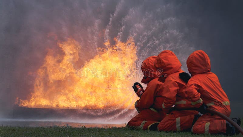 Firefighter Rescue Team Training in Fire Fighting Extinguisher ...