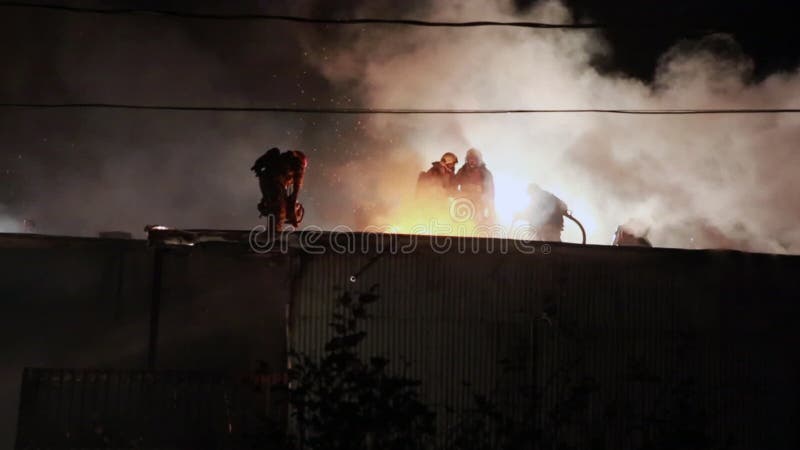 Firefighter Using Pike Hook for Wall on Fire. Stock Video - Video of ...