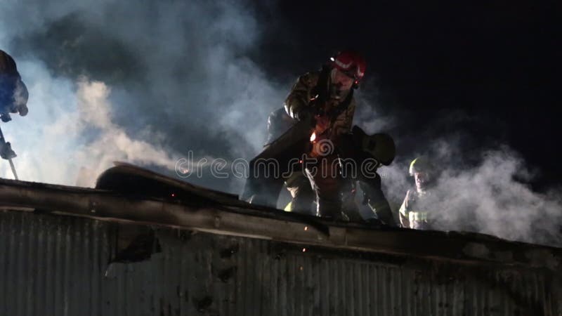 Firefighter Using Pike Hook for Wall on Fire. Stock Video - Video of ...