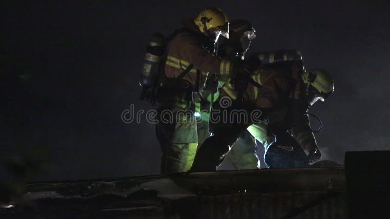 Firefighter Using Pike Hook for Wall on Fire. Stock Video - Video of ...