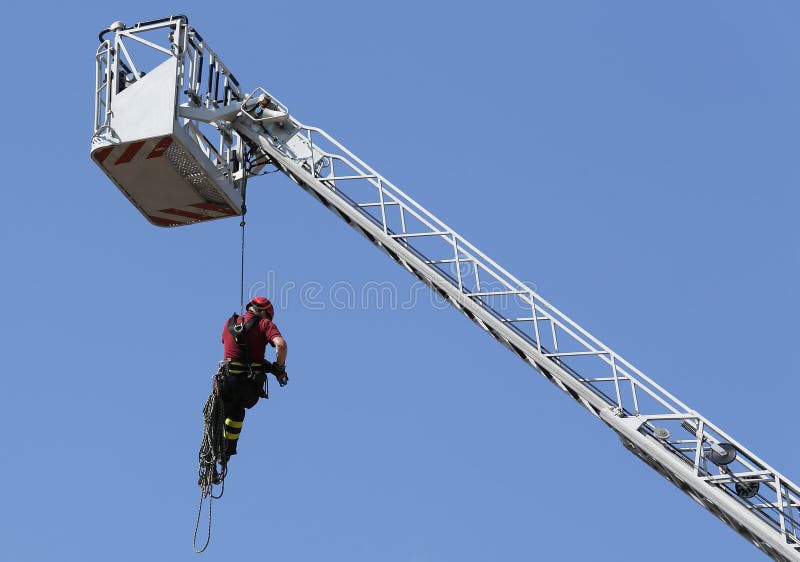 Firefighter with the Rope Climbing in Firehouse Stock Image - Image of ...