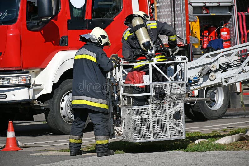 Firefighter at the Scene of a Fire Stock Photo - Image of tank, pump ...
