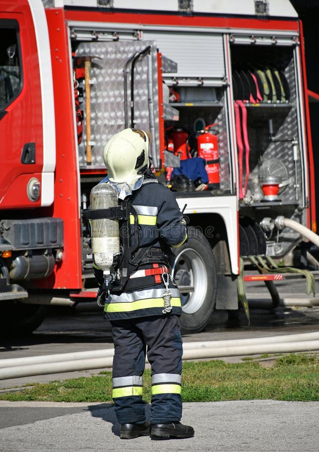 Firefighter at the Scene of a Fire Stock Photo - Image of equipment ...