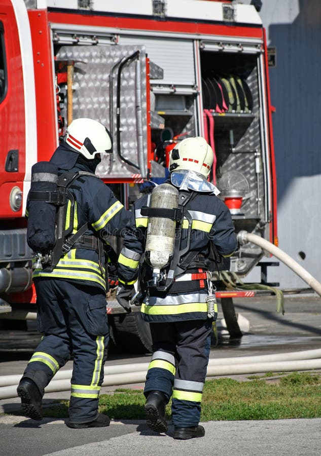 Firefighter at the Scene of a Fire Stock Image - Image of wear, water ...
