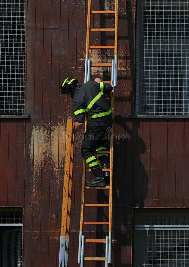 Firefighter Setting Up Ladder during Training Session at Fire Station ...