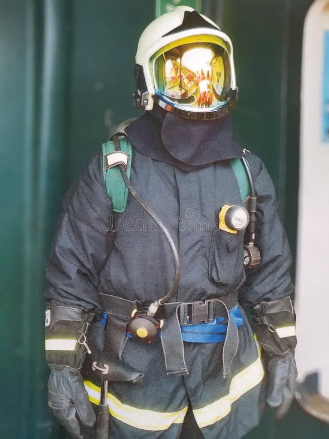 Firefighter on the Ship in Full Uniform and Ready To Extinguish the ...