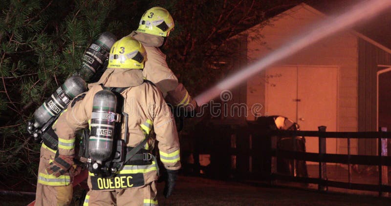Firefighter Spray Water with Hose on Burned House Stock Footage - Video ...