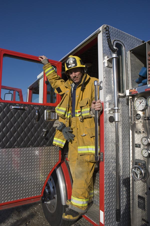 Firefighter Standing at the Fire Brigade S Door Stock Image - Image of ...
