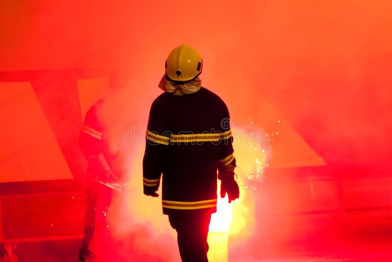 Firefighter Standing in the Torch Smoke Stock Image - Image of people ...