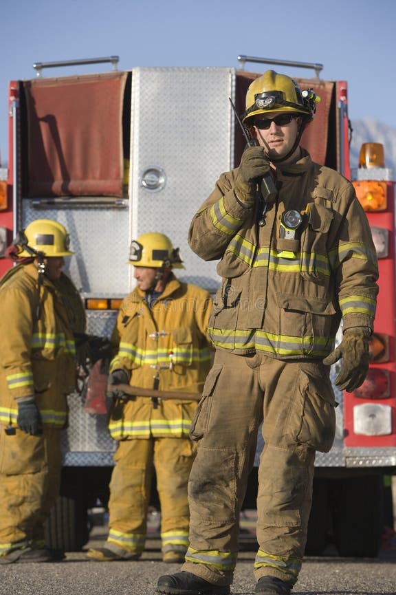 Firefighter Talking on Radio Stock Image - Image of mature, length ...