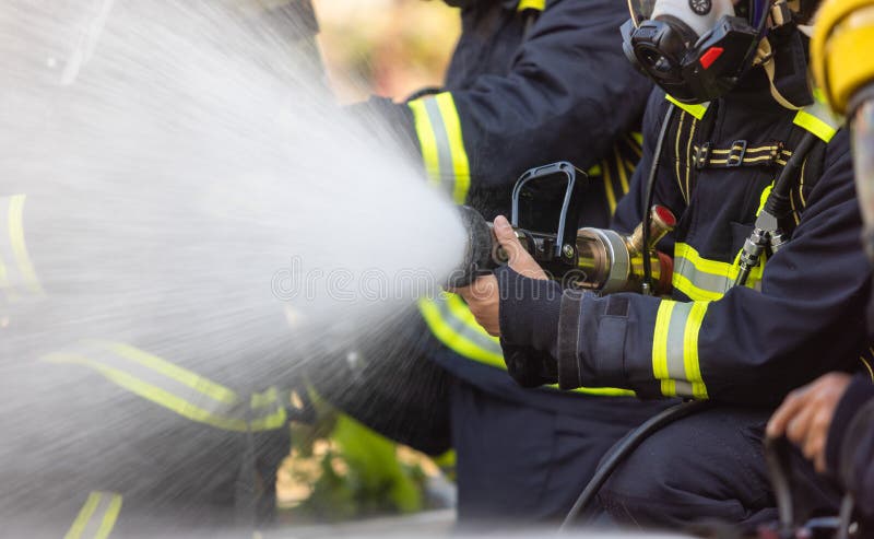 Firefighter Team Spay Water To Fire Stock Image - Image of control ...