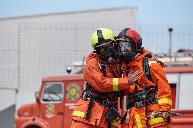 Firefighter Team Training with Various Tools in Professional Gear Stock ...