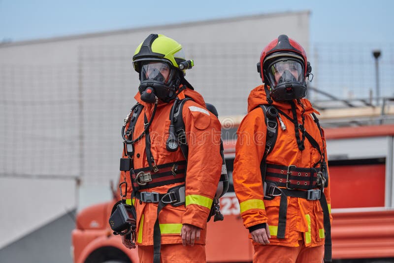 Firefighter Team Training with Various Tools in Professional Gear Stock ...