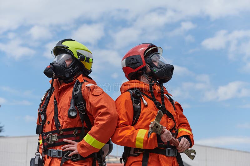 Firefighter Team Training with Various Tools in Professional Gear Stock ...