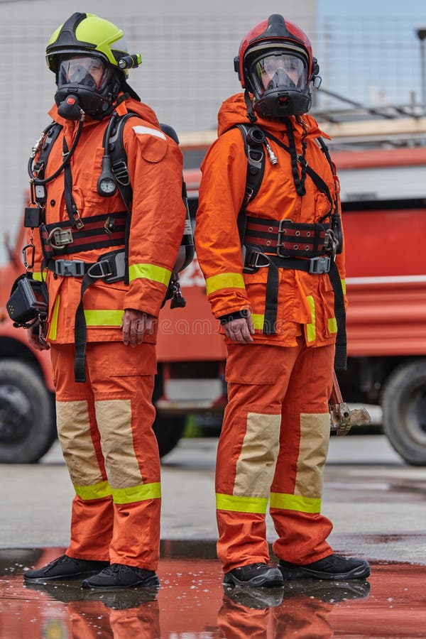 Firefighter Team Training with Various Tools in Professional Gear Stock ...