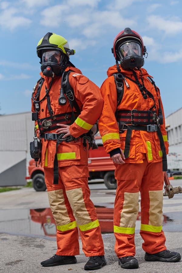 Firefighter Team Training with Various Tools in Professional Gear Stock ...