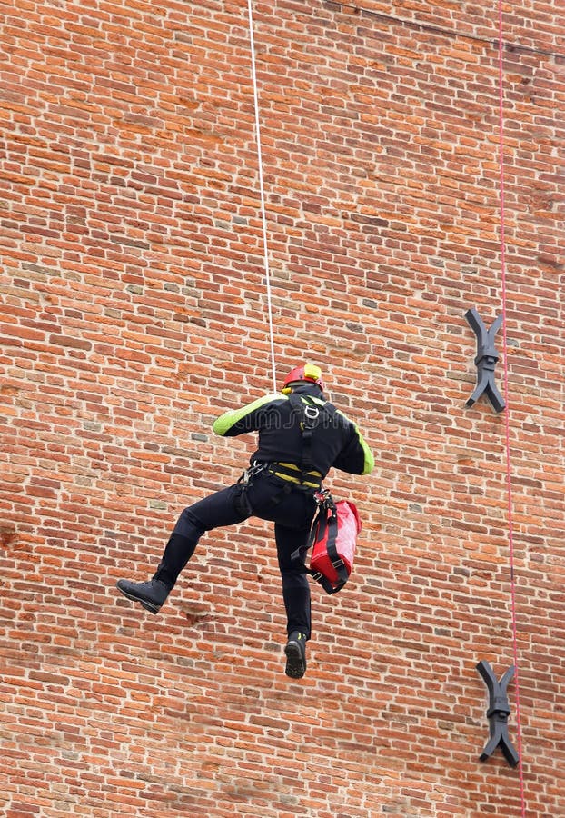 Fireman Climbing Expert during the Ascent Abseiling from a Build ...