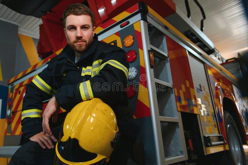 Firefighter in Uniform and Helmet Near Fire Engine Stock Photo - Image ...