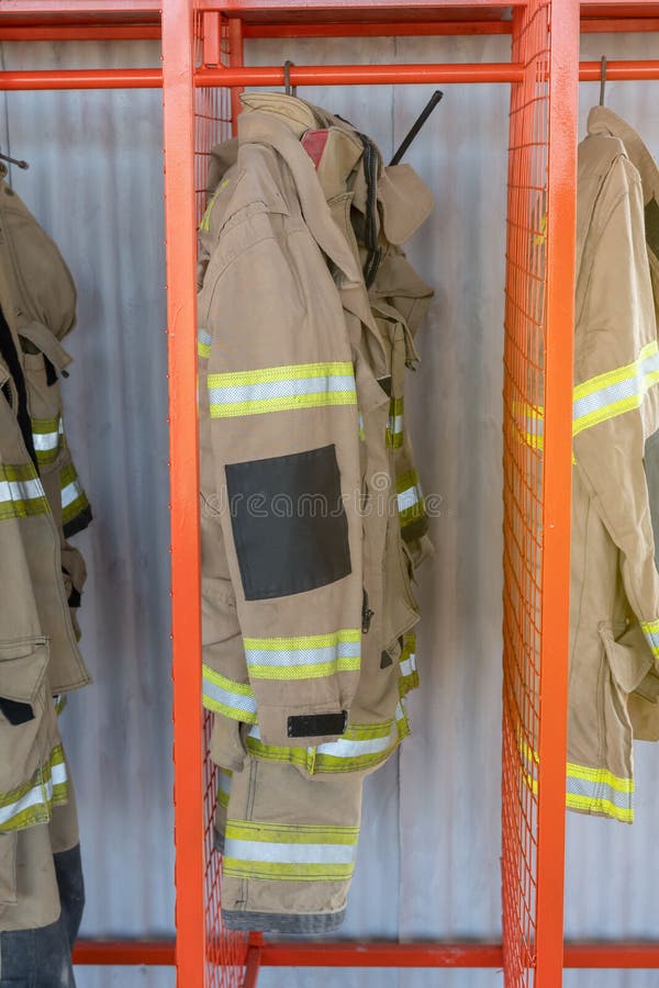 Firefighter Uniforms at Station Vertical Photo Stock Photo - Image of ...