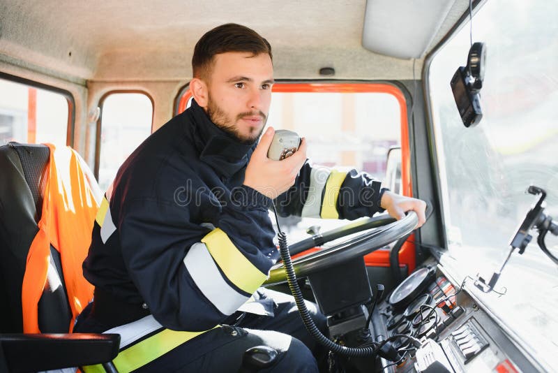 Firefighter Using Portable Radio Set in Fire Truck, Space for Text ...