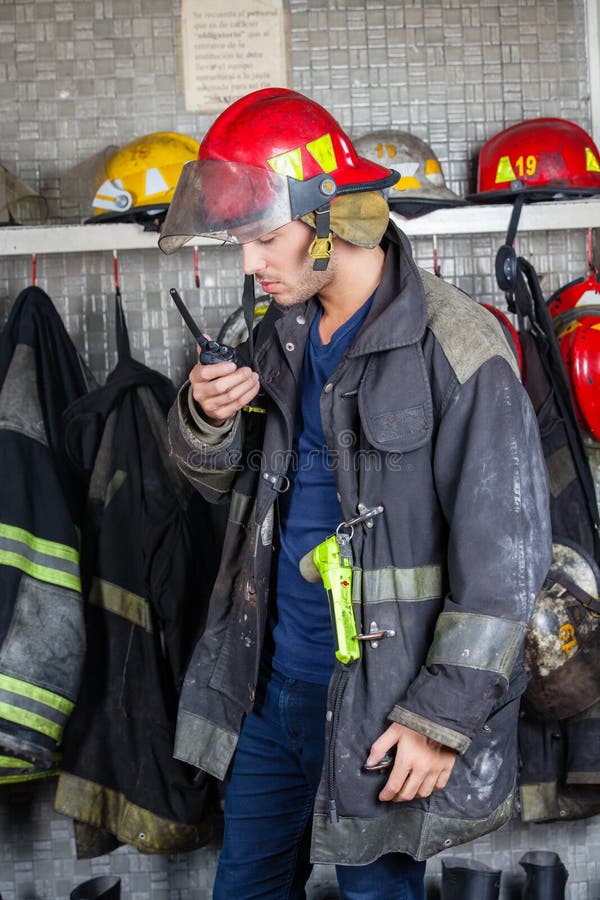 Firefighter Using Walkie Talkie in Fire Station Stock Image - Image of ...