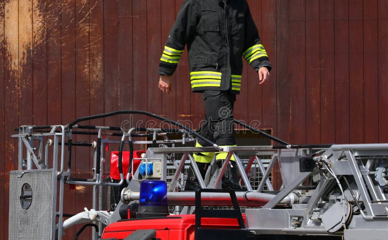 Firefighter Walks on the Fire Truck Ladder during the Emergency Stock ...