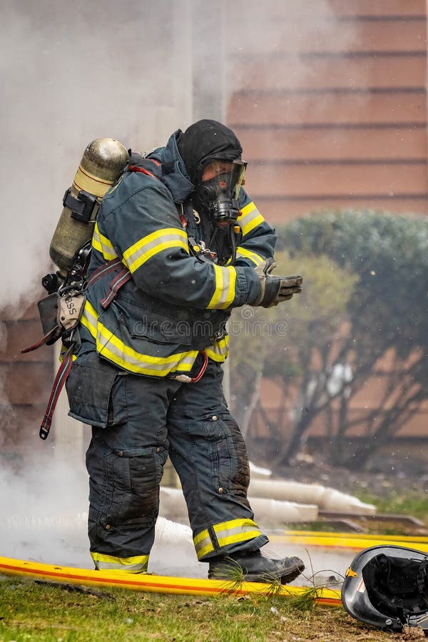 Firefighter Wearing Protective Gear and Oxygen Mask Editorial Stock ...