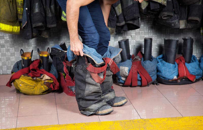 Firefighter Wearing Uniform at Fire Station Stock Photo - Image of ...