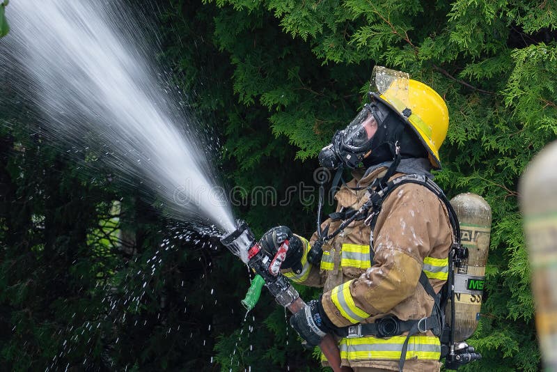 Firefighter at Work during a House Fire Editorial Stock Photo - Image ...