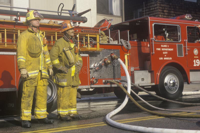 Firefighter Working with Fire Hose Editorial Stock Photo - Image of ...
