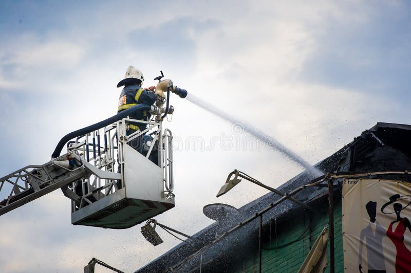 Firefighters in Action Fighting Fire Stock Photo - Image of hose, alarm ...