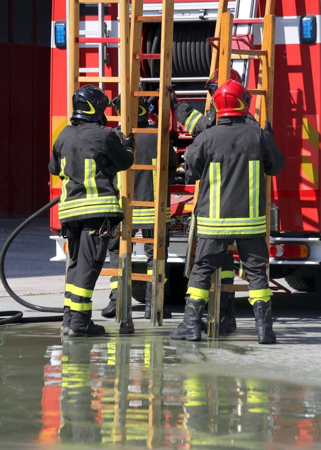 Ladder of Firefighters during an Emergency To Save the Citizens Stock ...