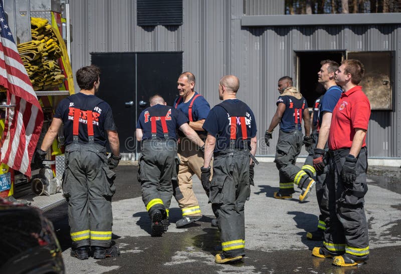 Firefighters Behind Fire Engine Editorial Stock Image - Image of ...
