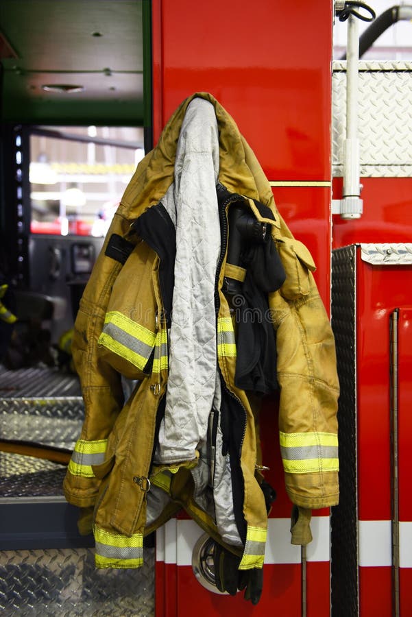 A Firefighters Coat Hanging on the Outside of a Fire Engine Stock Image ...