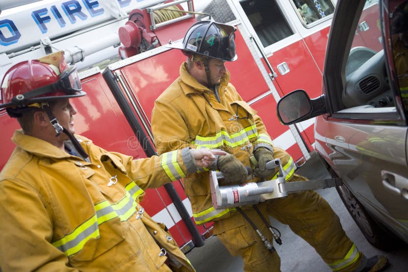 Firefighters Helping an Injured Woman in a Car Stock Image - Image of ...