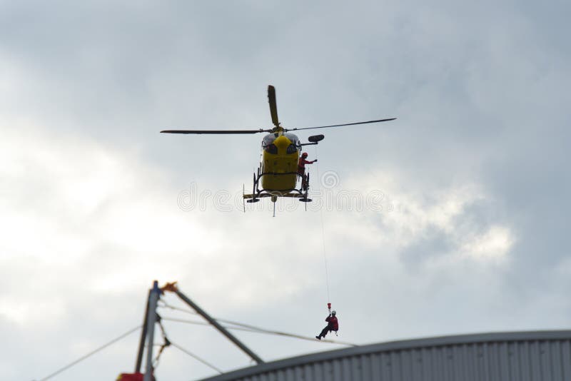 Firefighters Evacuating a Casualty by Helicopter during a Training ...