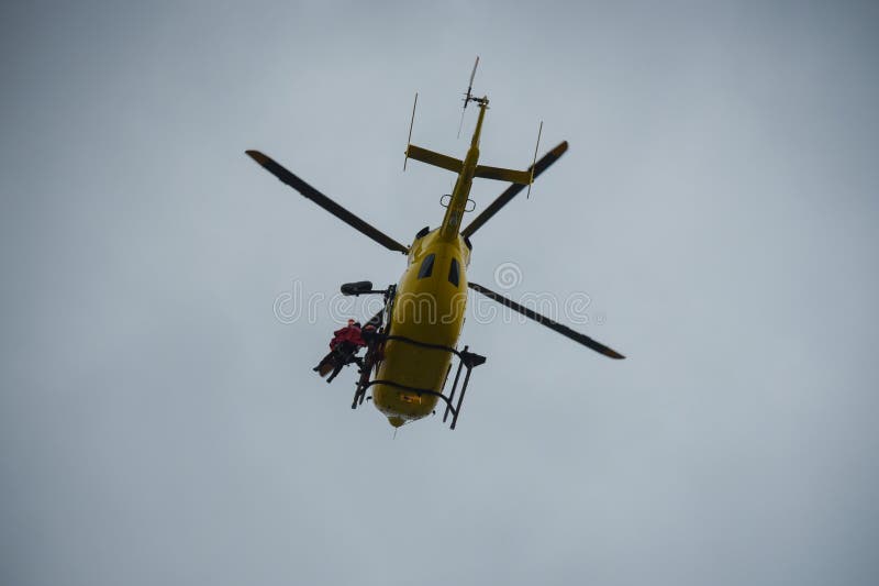 Firefighters Evacuating a Casualty by Helicopter during a Training ...