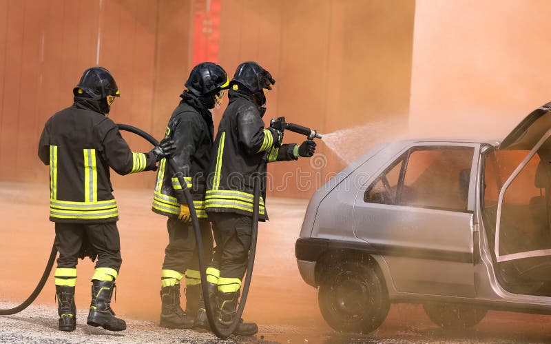 Firefighters Extinguish the Fire of the Crashed Car after the Accident ...