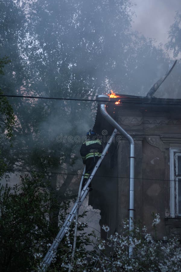 Firefighters Extinguish a Fire in an Old House Stock Image - Image of ...