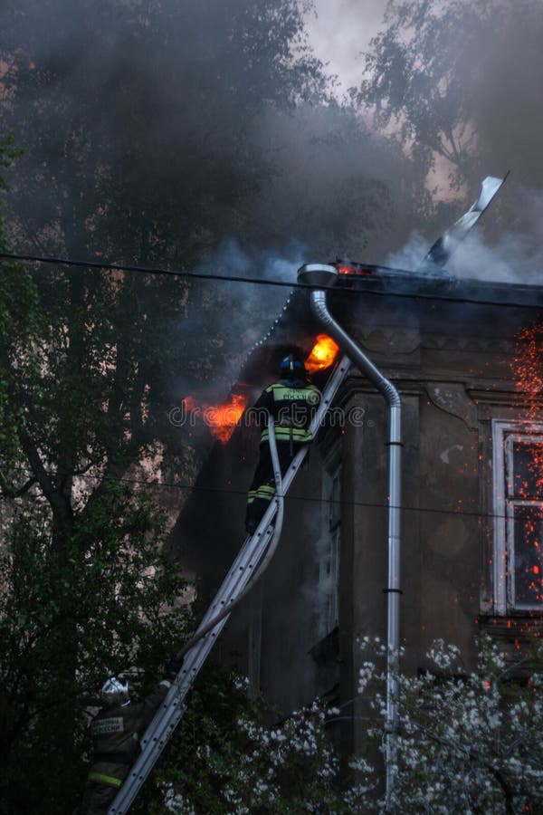 Firefighters Extinguish a Fire in an Old House Stock Image - Image of ...